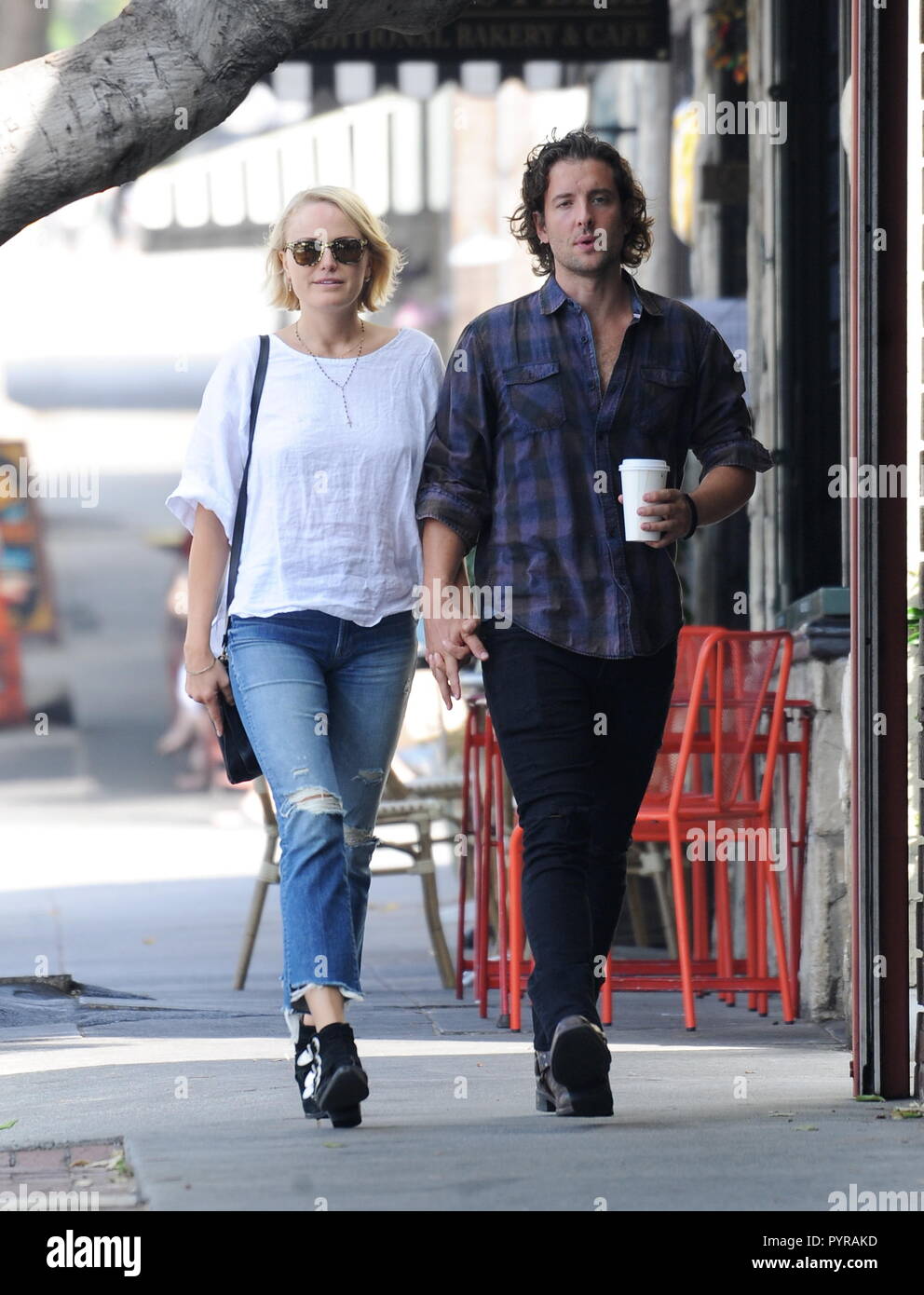 Actress Malin Akerman and fiance Jack Donnelly hold hands after a ...