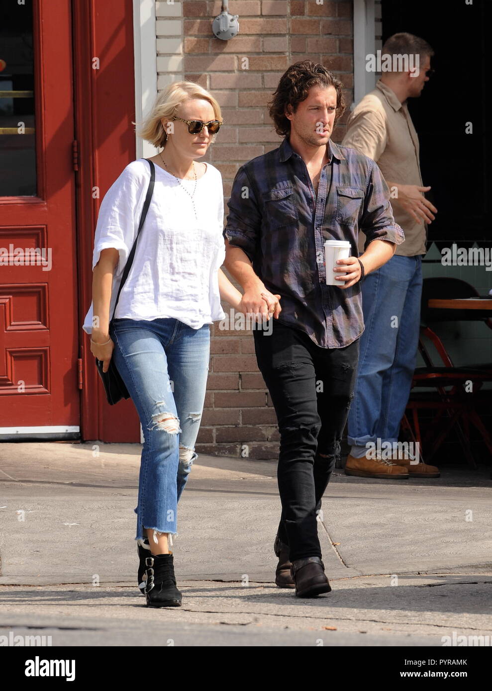Actress Malin Akerman and fiance Jack Donnelly hold hands after a ...