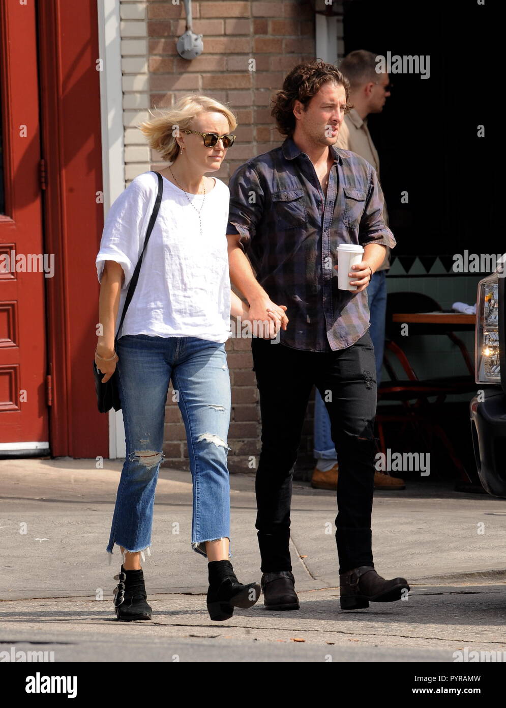 Actress Malin Akerman and fiance Jack Donnelly hold hands after a ...