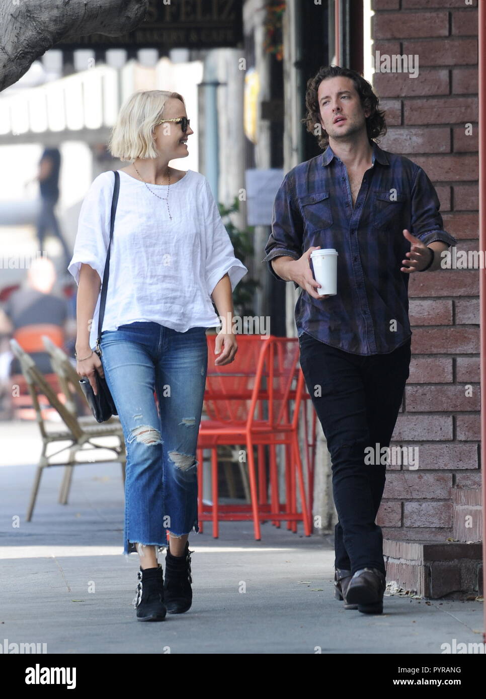 Actress Malin Akerman and fiance Jack Donnelly hold hands after a ...