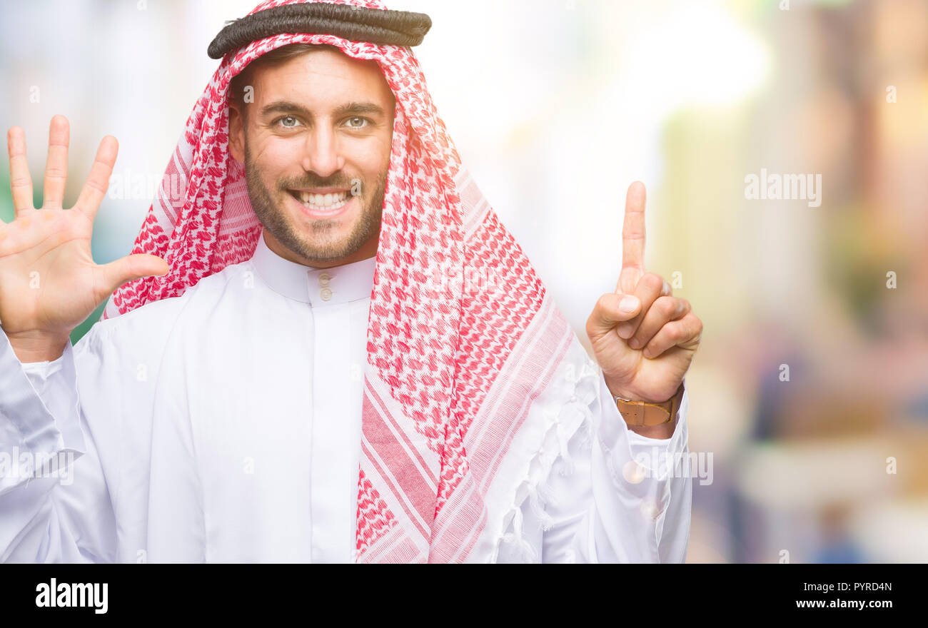 Young handsome man wearing keffiyeh over isolated background showing ...