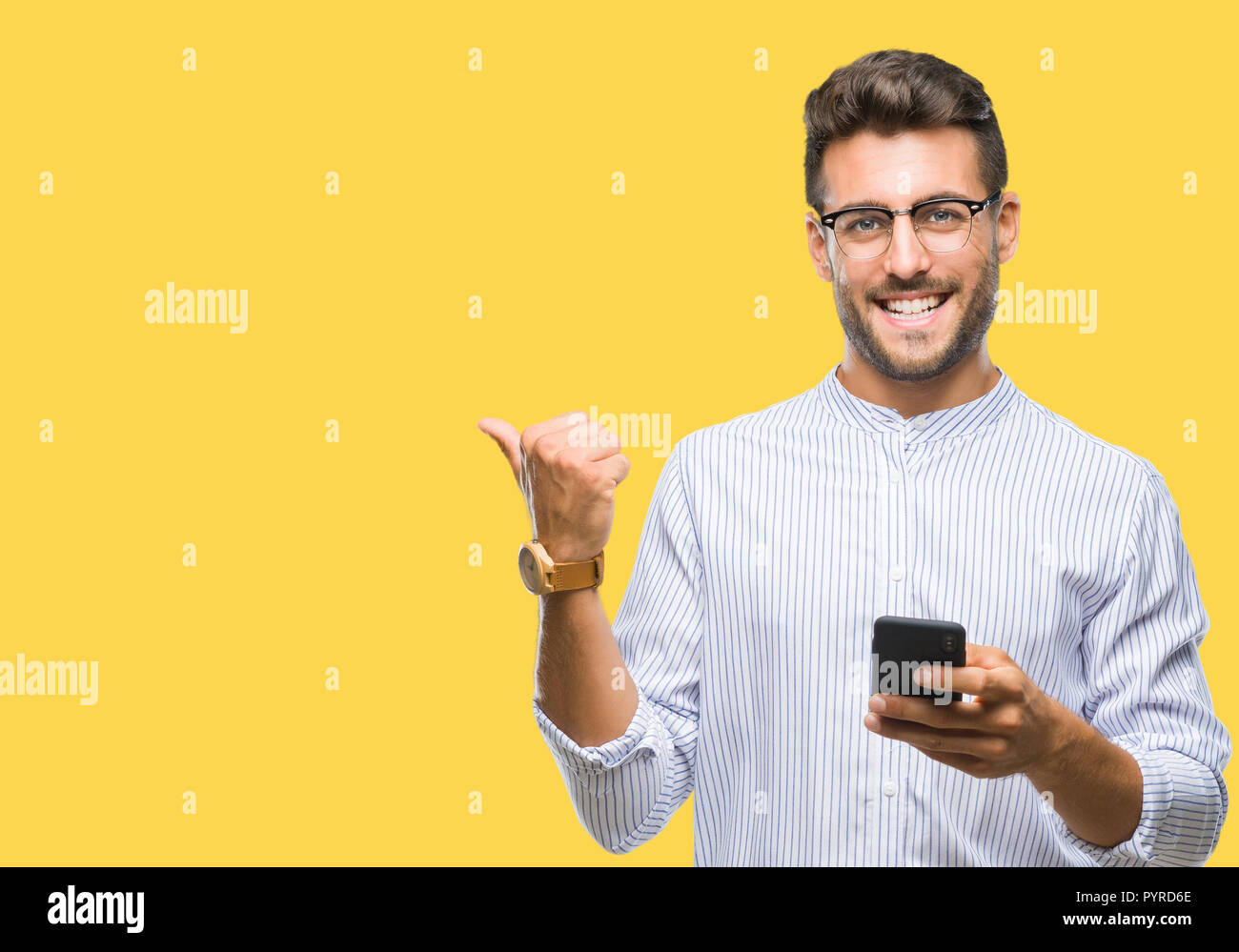 Young handsome man texting using smartphone over isolated background ...