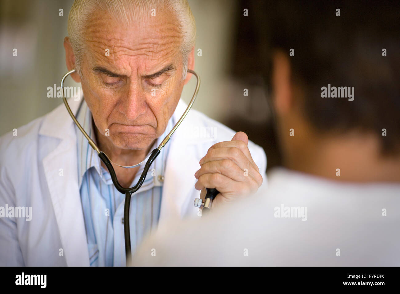 View of a doctor checking up a patient Stock Photo - Alamy