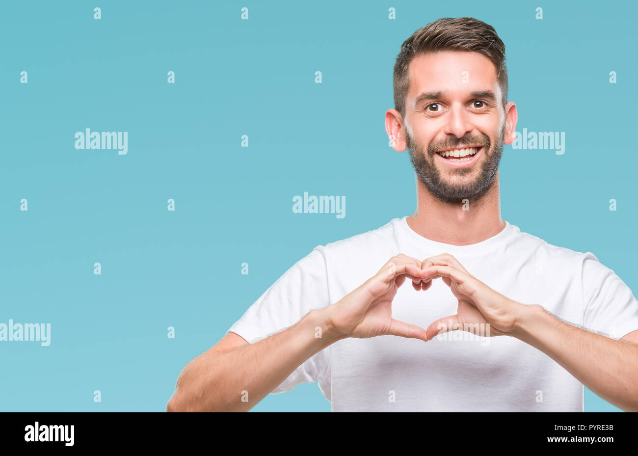 Young handsome man over isolated background smiling in love showing ...