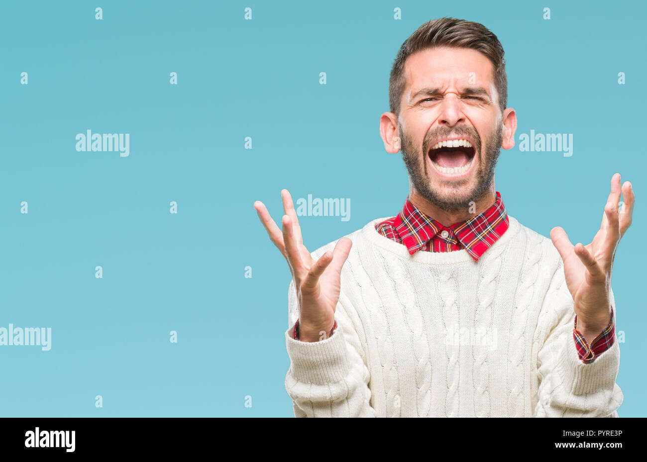 Young handsome man wearing winter sweater over isolated background ...