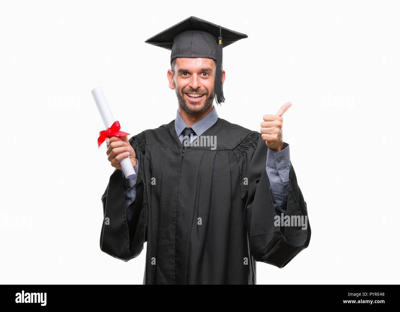 Young handsome graduated man holding degree over isolated background ...