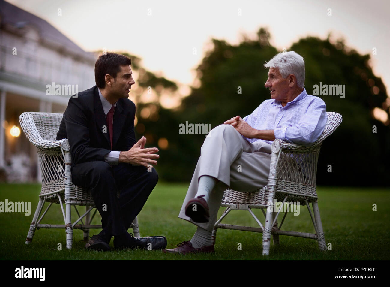 View of two gentlemen in formal attire having a conversation Stock ...