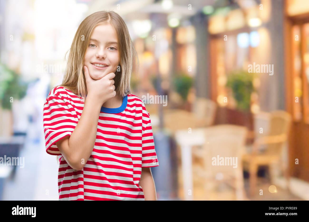 Young beautiful girl over isolated background looking confident at the ...