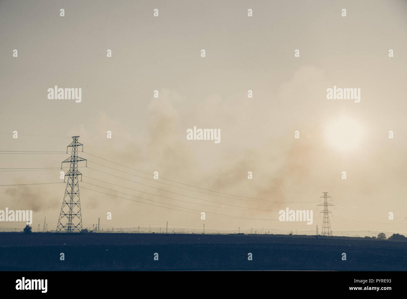 Smoke of burning corn field.Burning corn field after the harvest Stock ...
