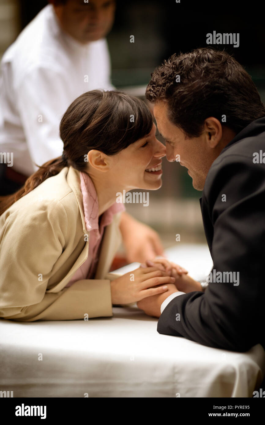 Side view of a couple in a romantic mood Stock Photo - Alamy