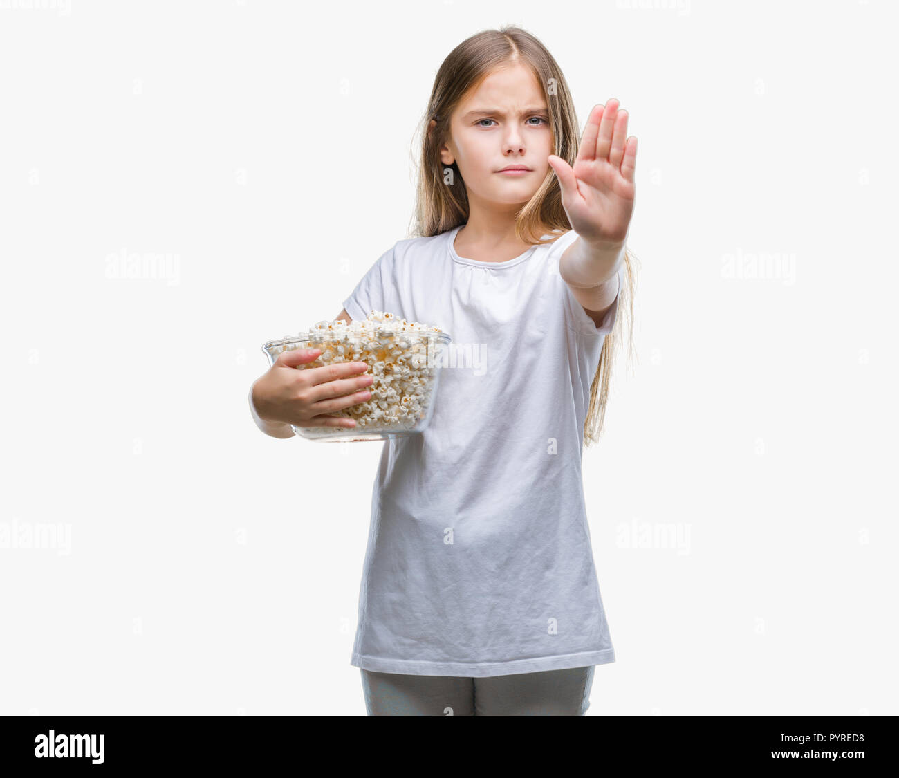 Young beautiful girl eating popcorn snack isolated background with open ...