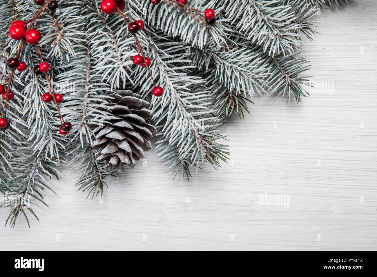 Christmas wooden background with snow fir tree and decoration. Top view ...