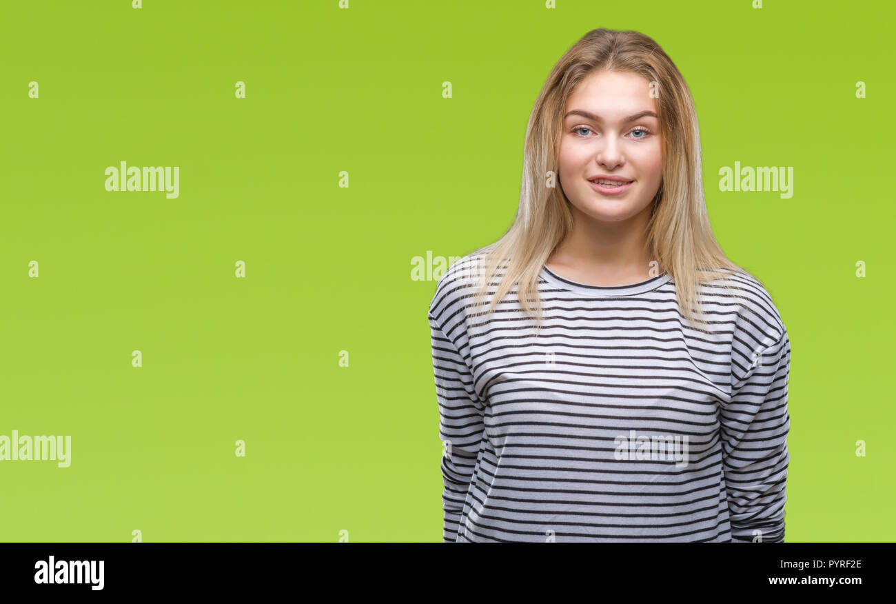 Young caucasian woman over isolated background with a happy and cool ...