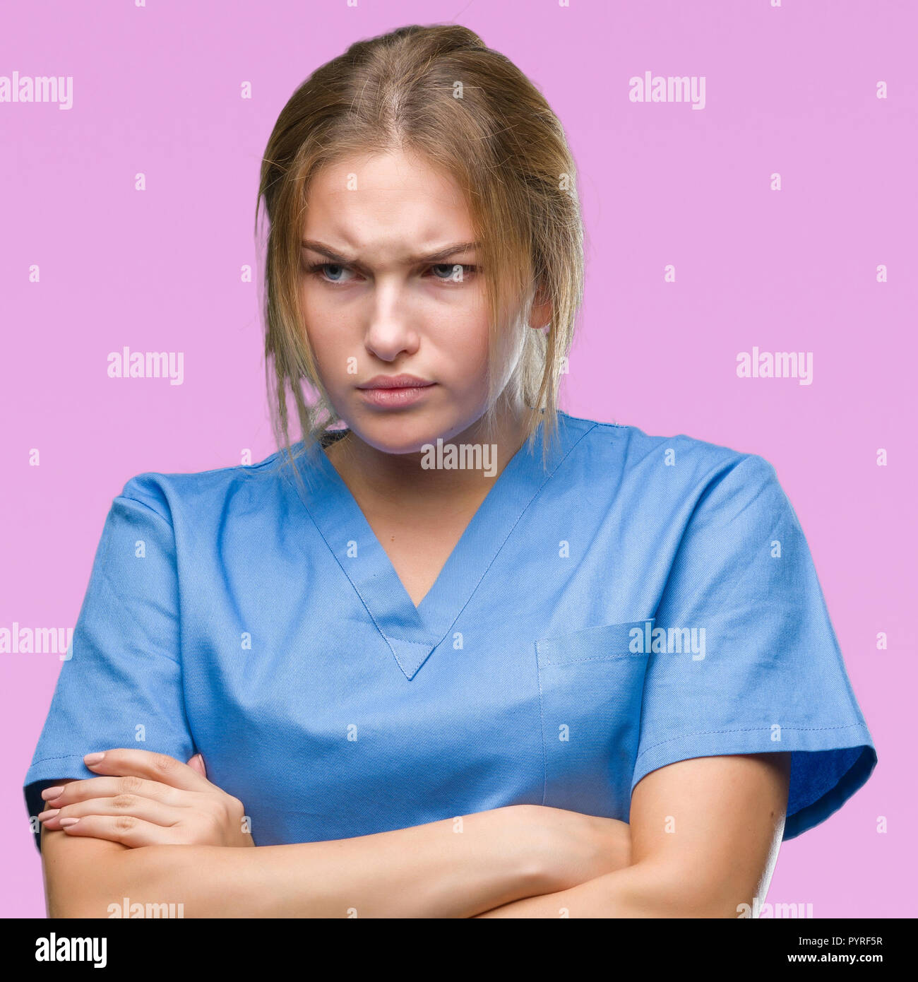 Young caucasian nurse woman wearing surgeon uniform over isolated ...