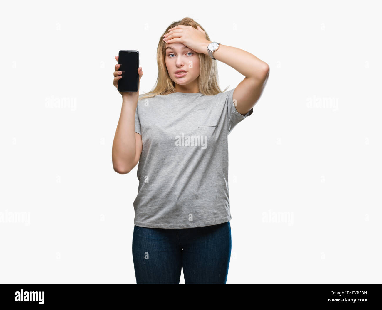 Young caucasian woman showing screen of smartphone over isolated ...