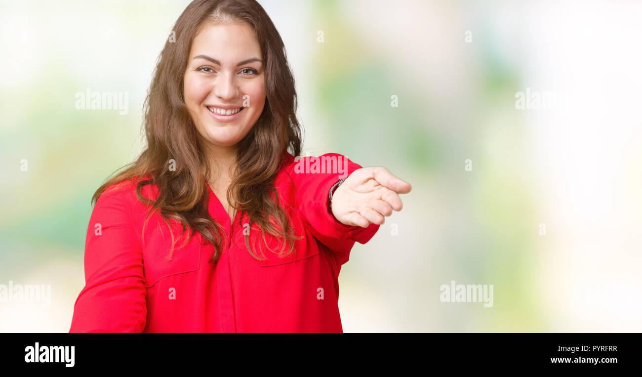 Beautiful plus size young business woman over isolated background ...