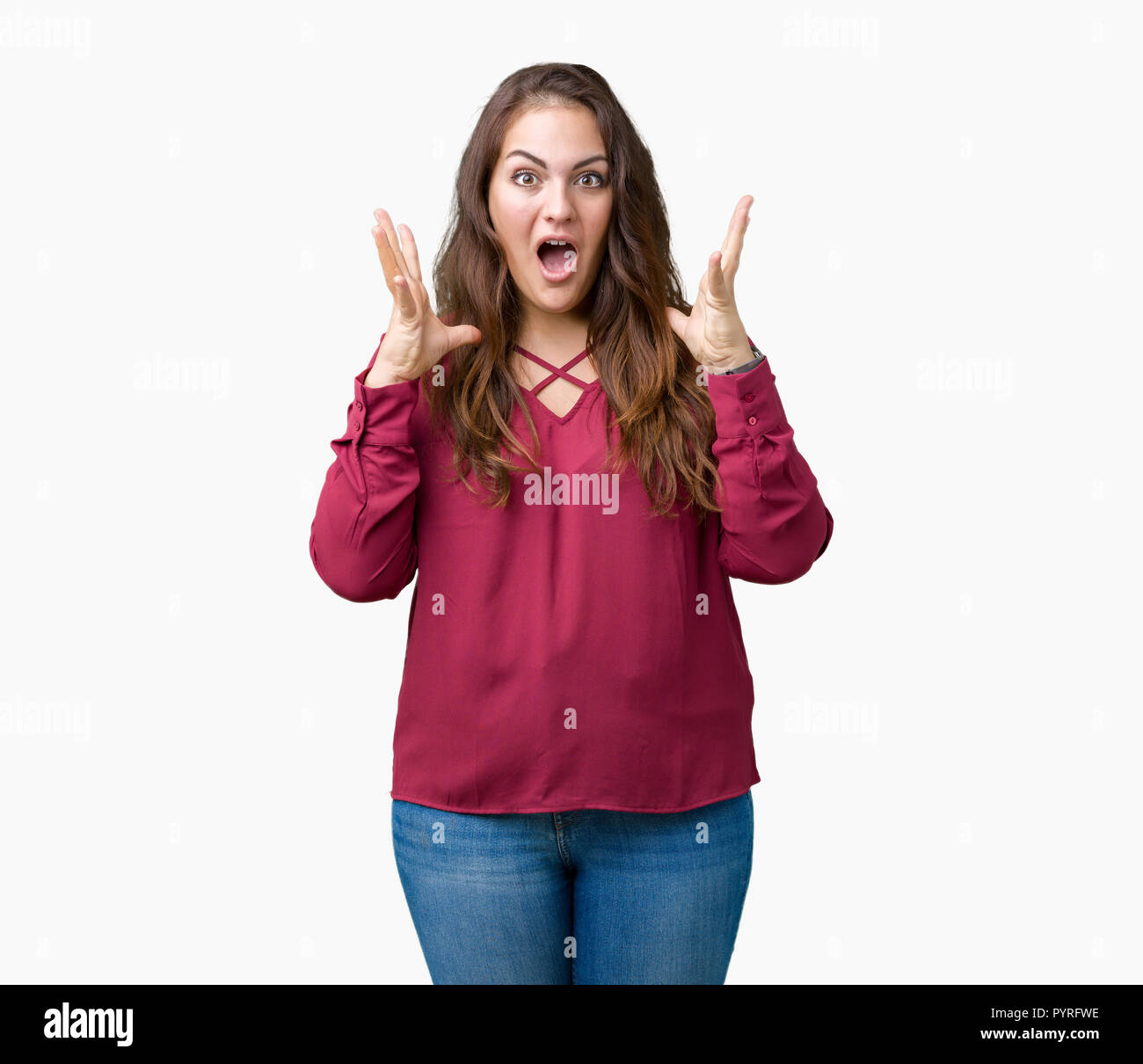 Beautiful plus size young woman over isolated background celebrating ...