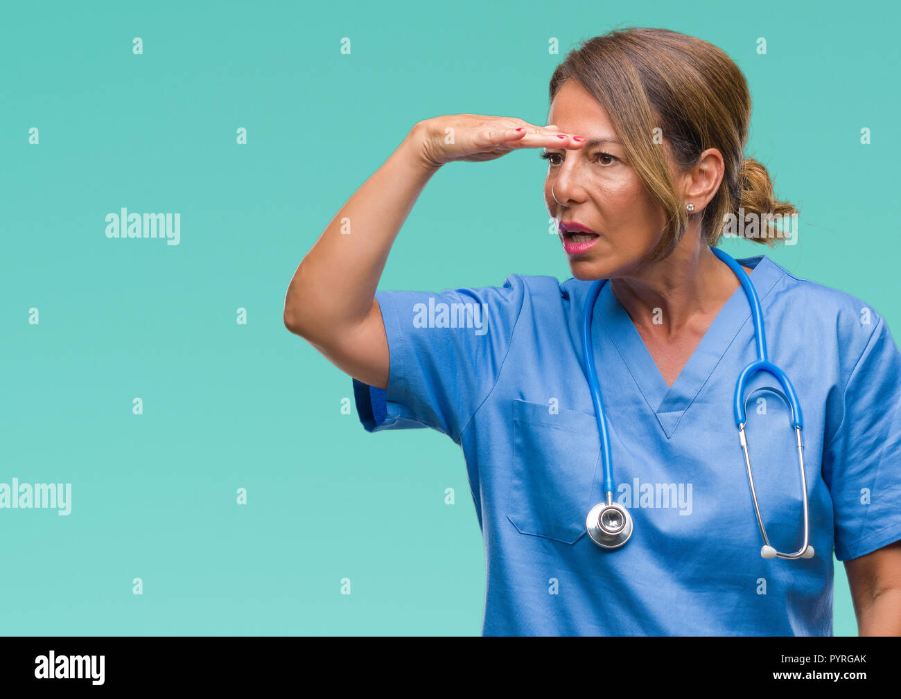 Middle age senior nurse doctor woman over isolated background very ...