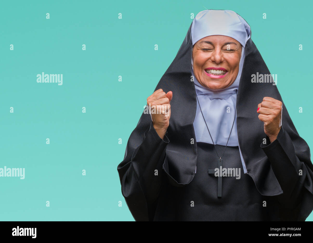 Middle age senior christian catholic nun woman over isolated background ...