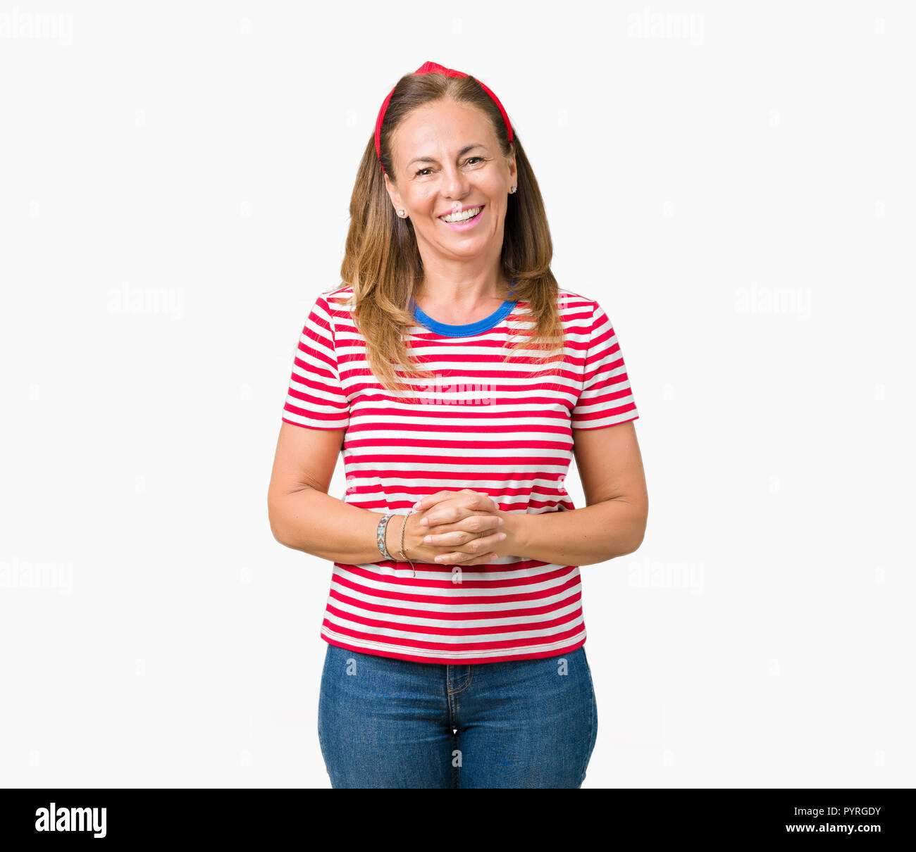 Beautiful middle age woman wearing casual stripes t-shirt over isolated ...