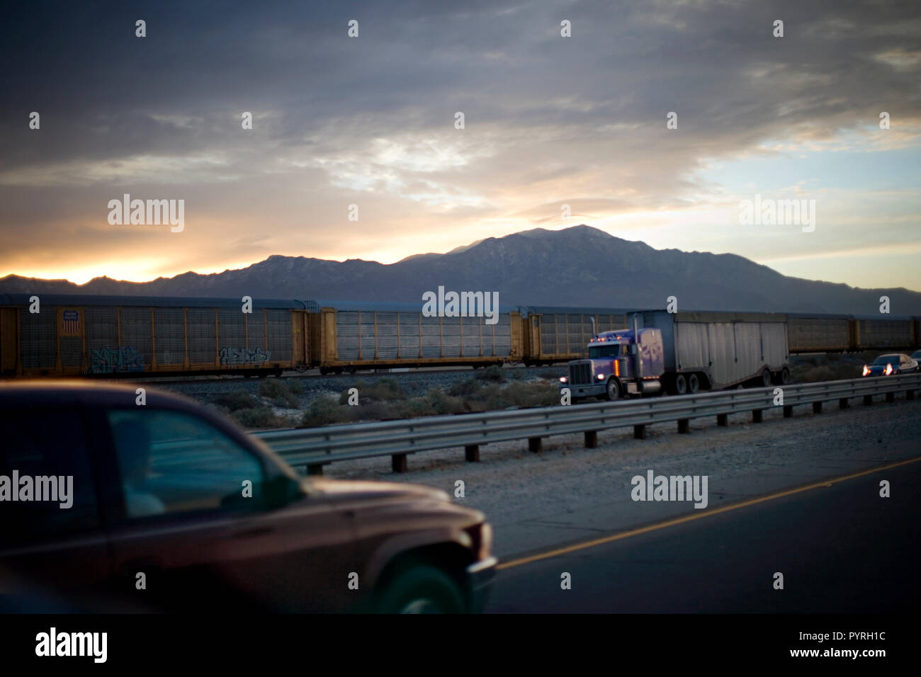 Truck driving alongside train hi-res stock photography and images - Alamy