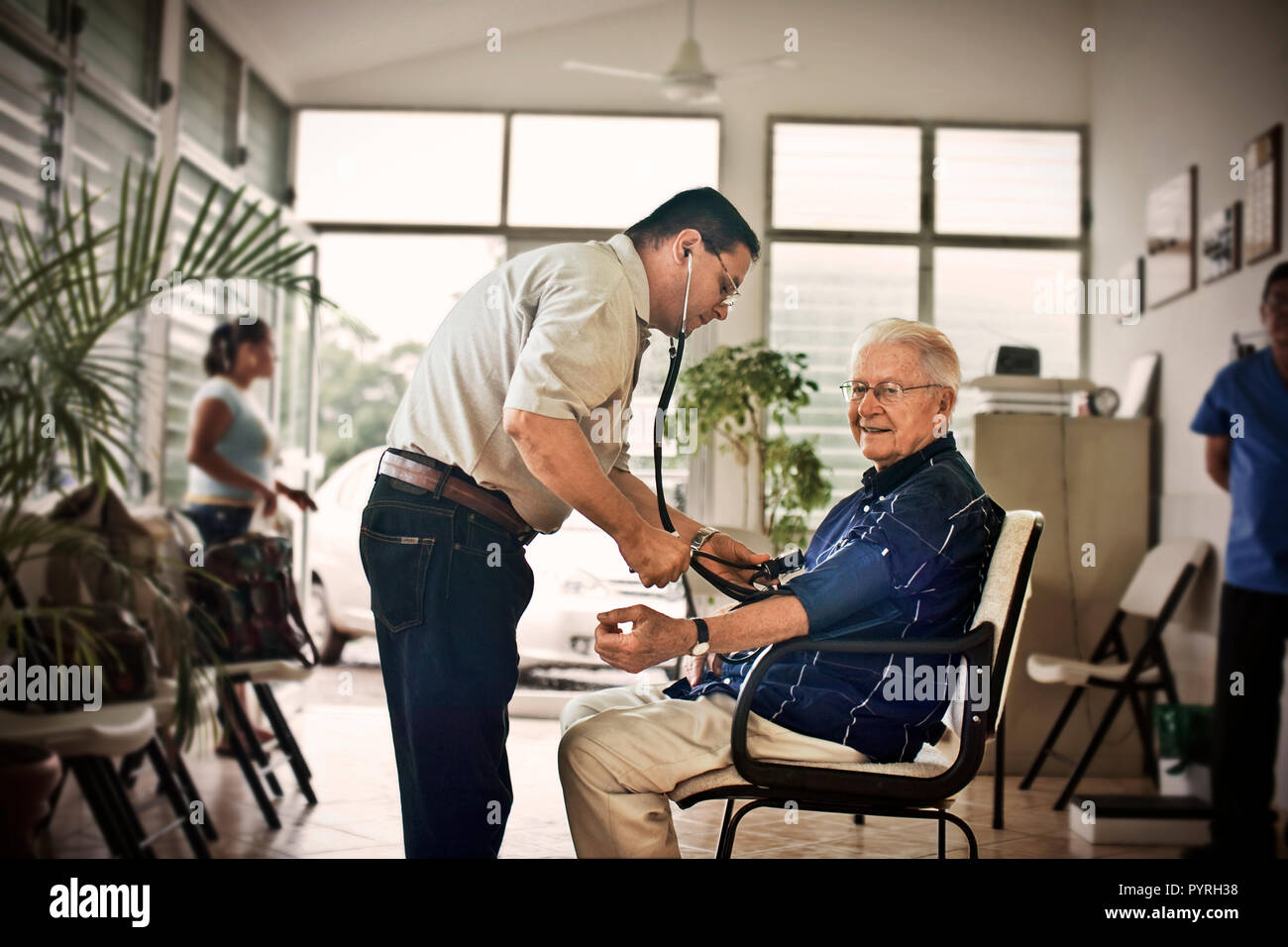 Senior man being checked over by a doctor Stock Photo - Alamy