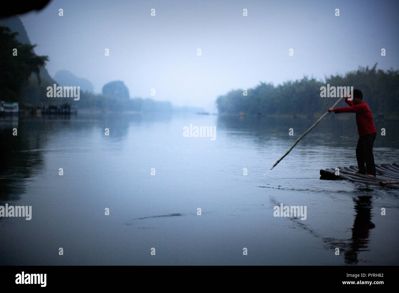 Man standing on raft stick hi-res stock photography and images - Alamy