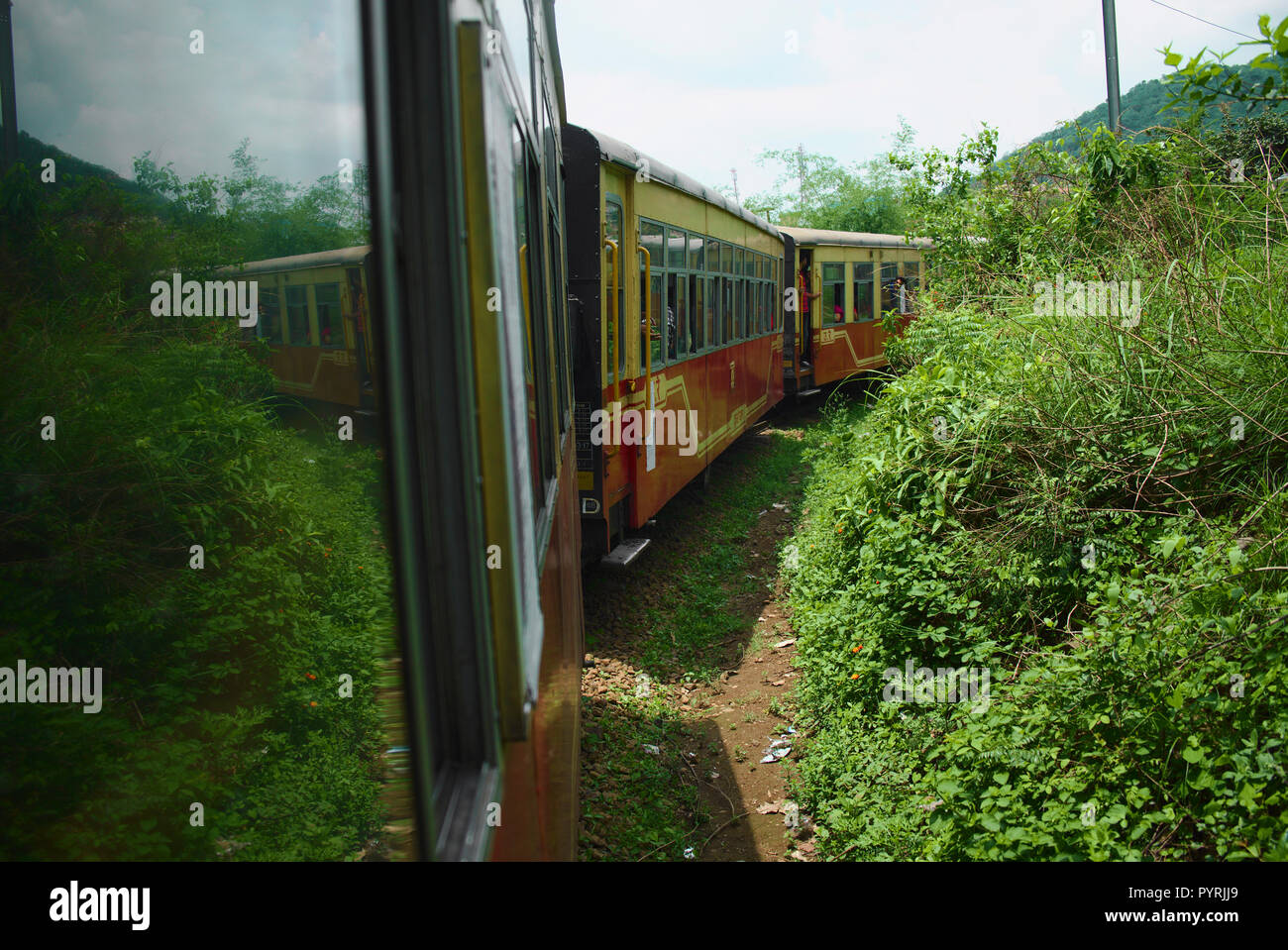 The narrow "toy train" (small, narrow-gauge train) that slowly climbs ...