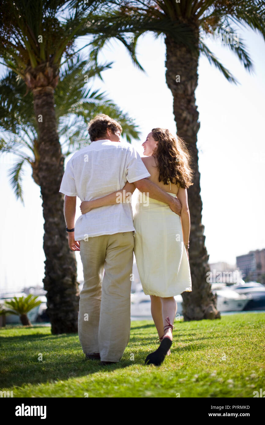 A couple with their arms around each other Stock Photo - Alamy