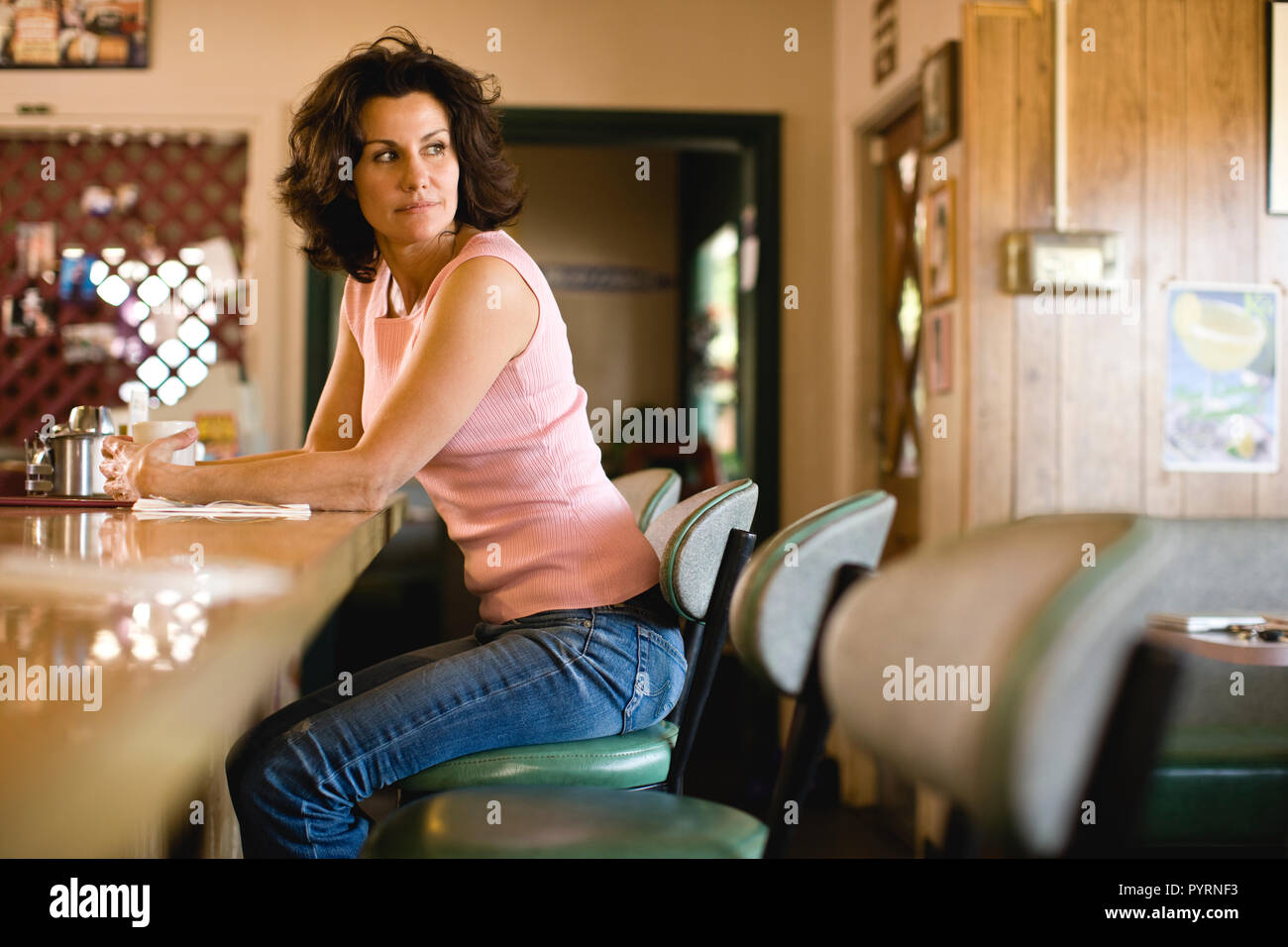 People sitting at counter hi-res stock photography and images - Alamy