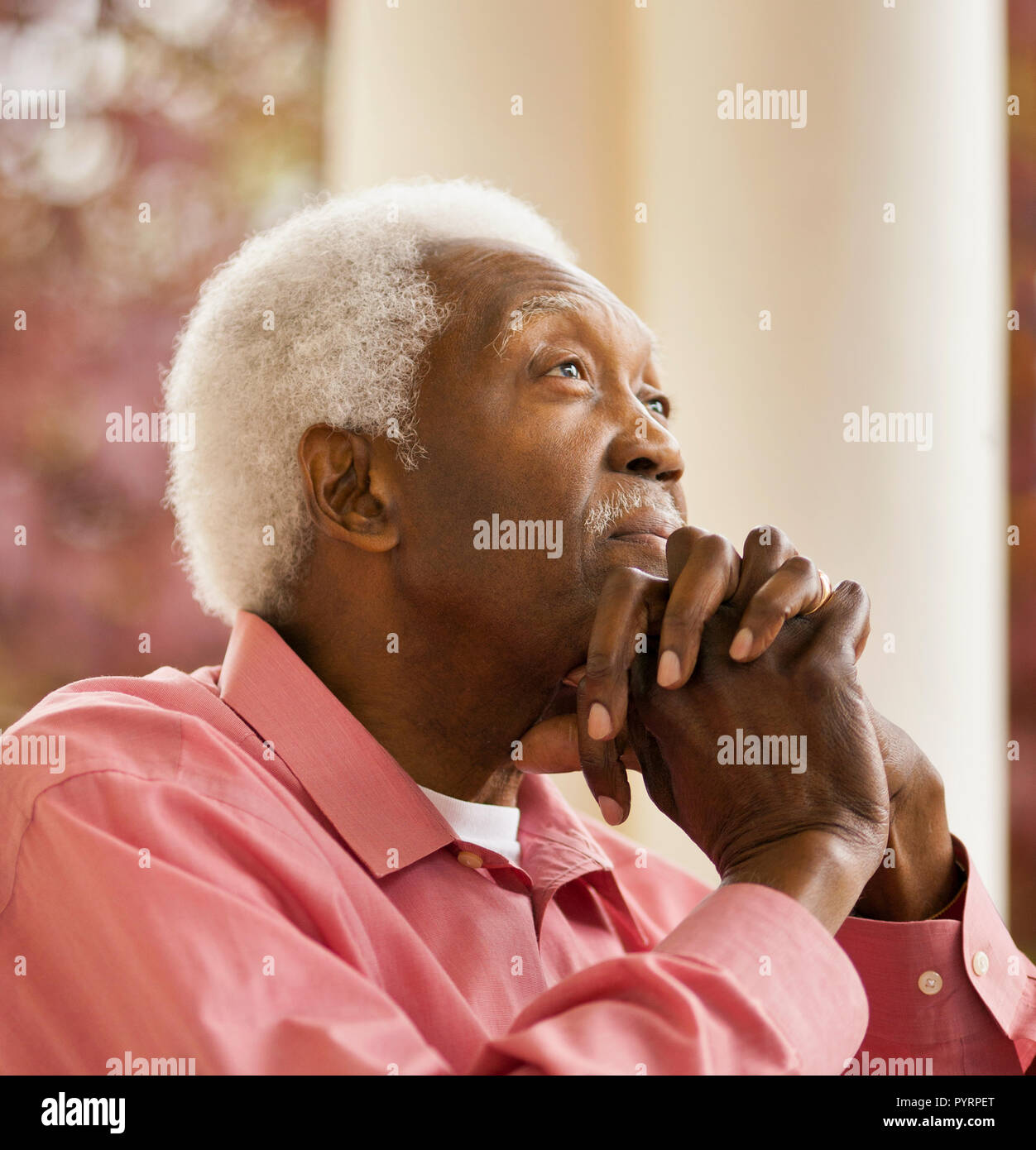 Senior man looking hopeful Stock Photo - Alamy
