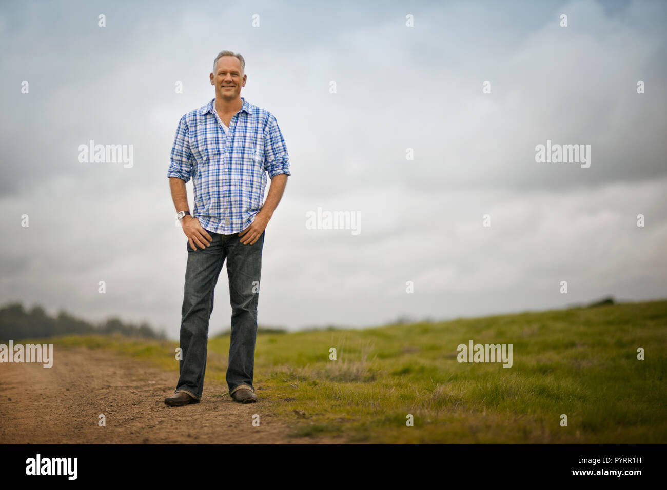 Portrait of a smiling middle aged man Stock Photo - Alamy