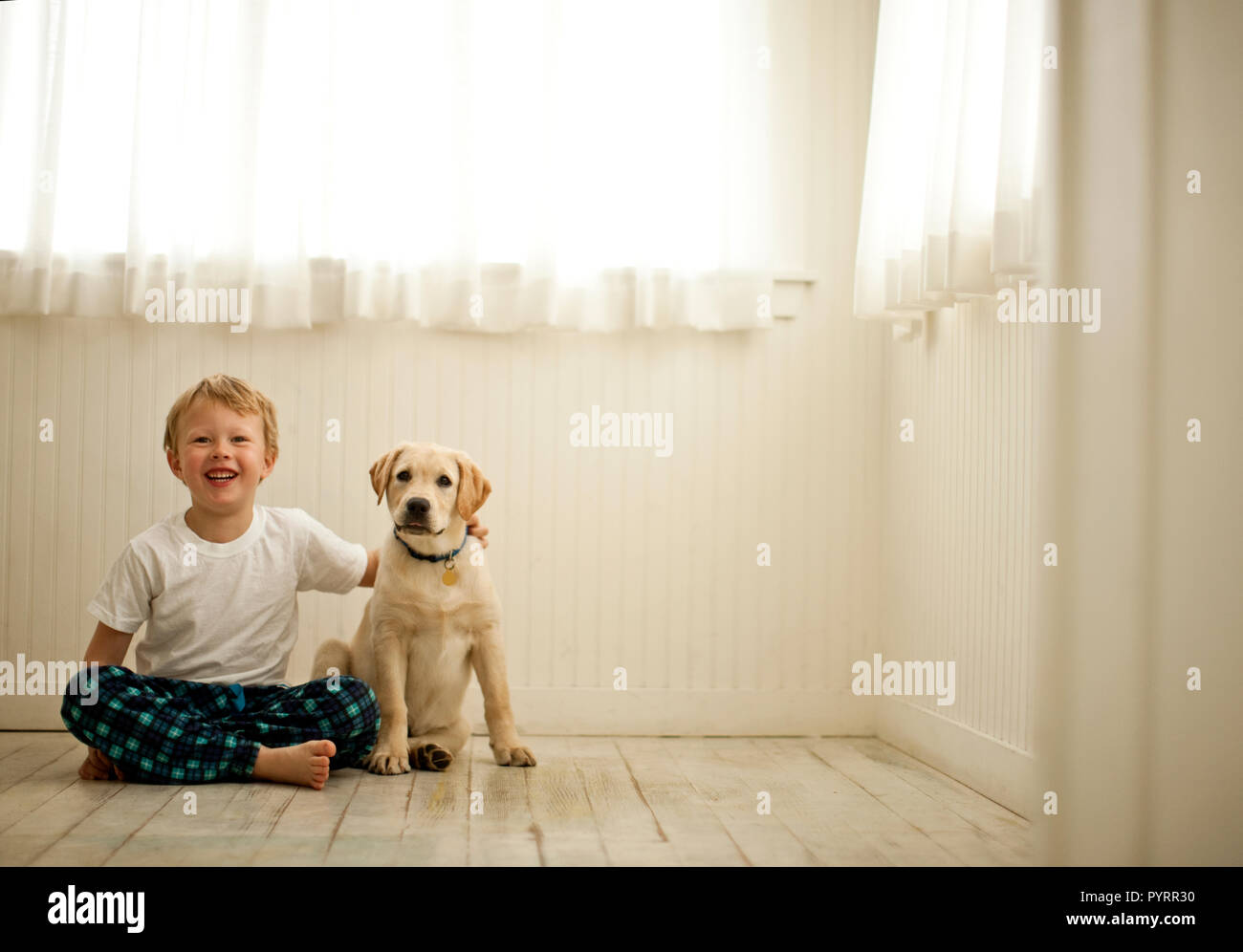 Portrait of young boy with his dog Stock Photo - Alamy