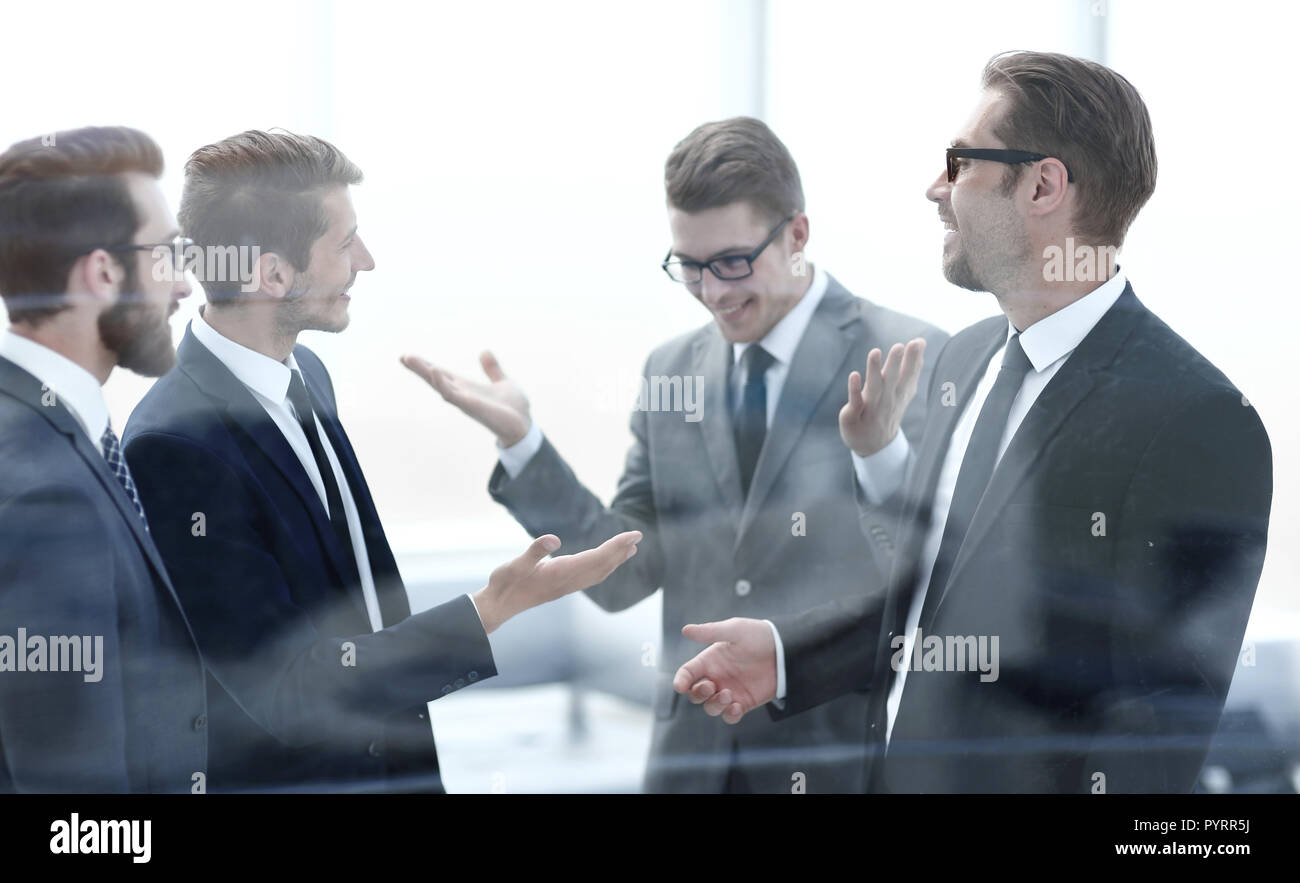 group of business people discussing common interests in the office ...