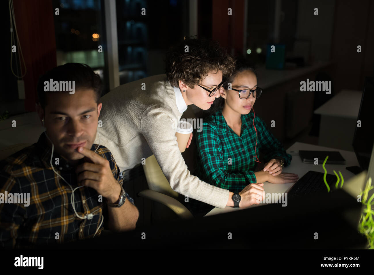 Group of Entrepreneurs Working at Night Stock Photo - Alamy