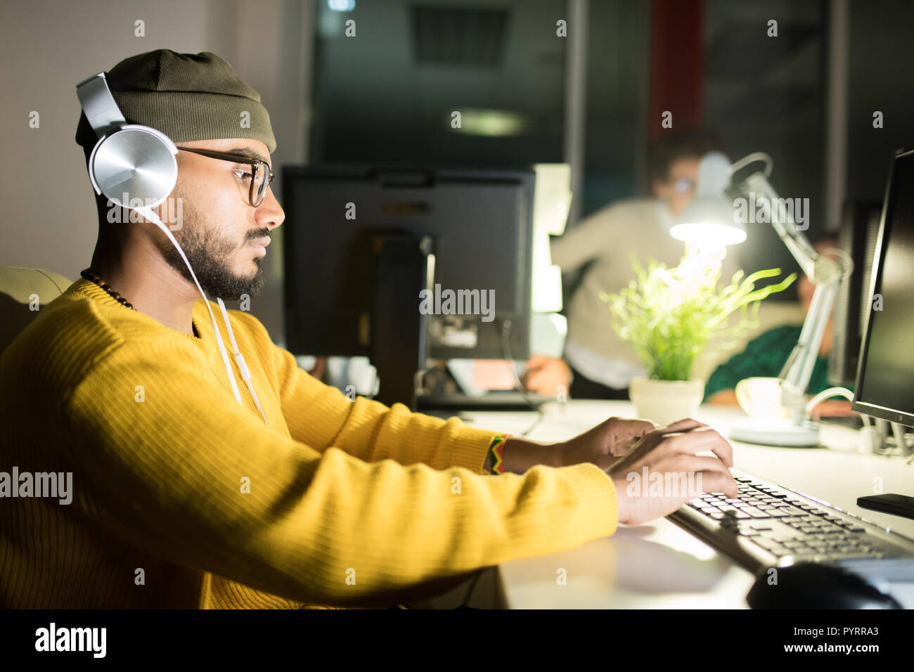 Computer Programmer Working Late Stock Photo - Alamy