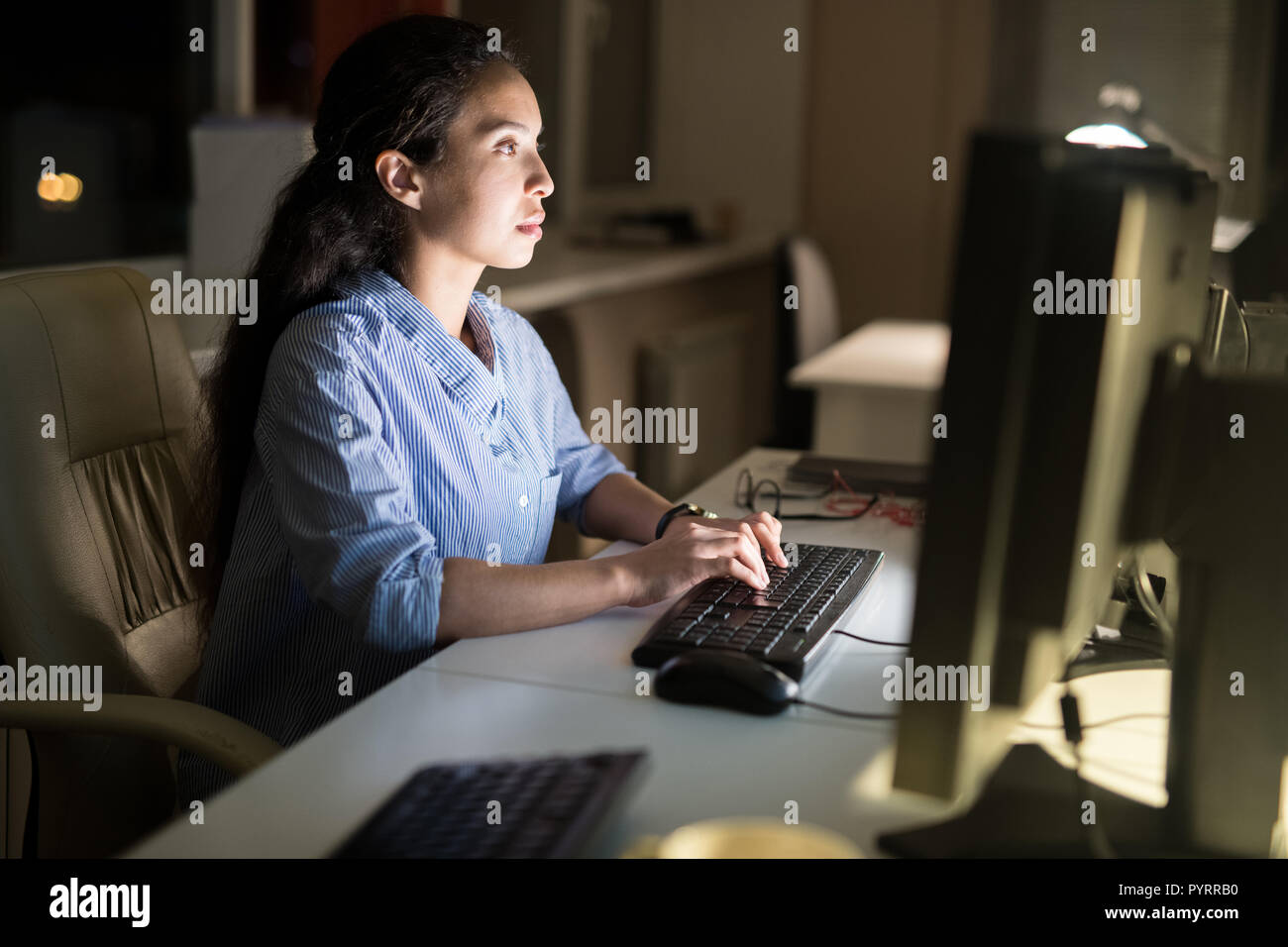 Young mixed race woman typing hi-res stock photography and images - Alamy