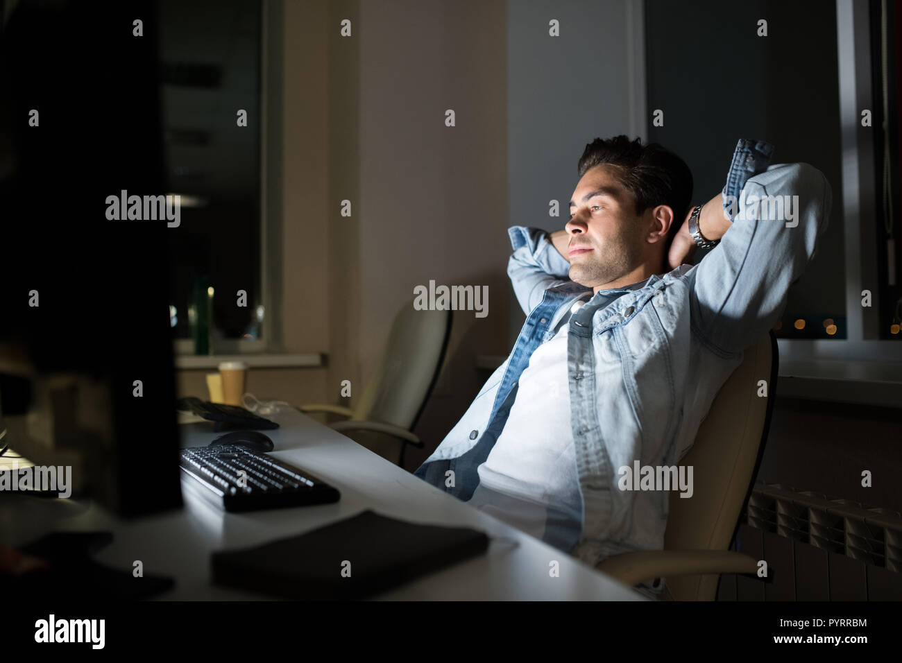 Man Resting at Workplace Stock Photo - Alamy