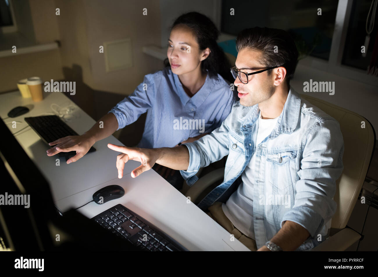 Colleagues using computer hi-res stock photography and images - Alamy