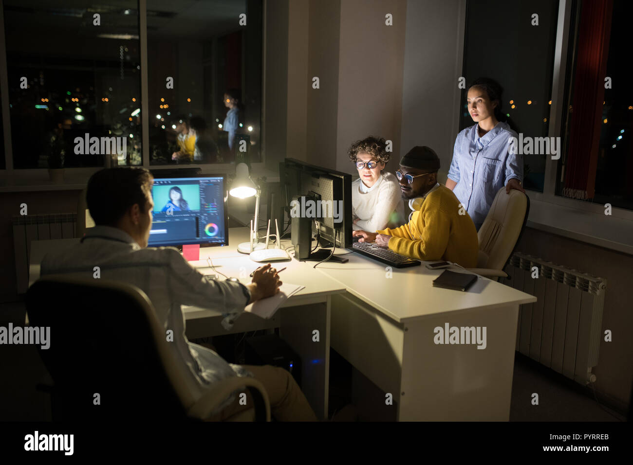 Creative People Working at Night Stock Photo - Alamy