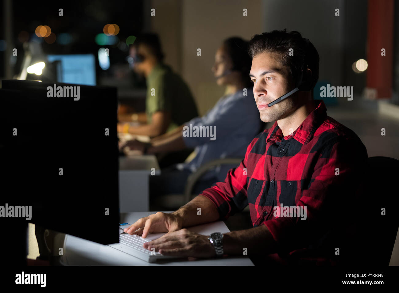 Customer Service Operator Working at Night Stock Photo - Alamy