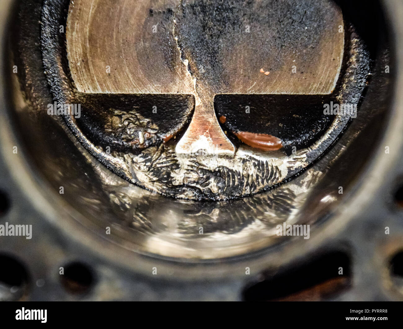 Disassembled engine piston system. Traces from the screw which got to ...