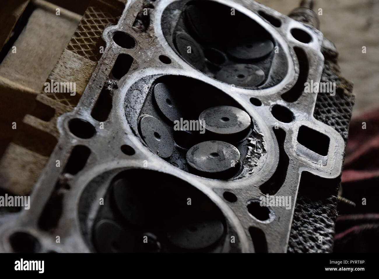 Valve in a deposit on the removed cover of the engine valve box Stock ...