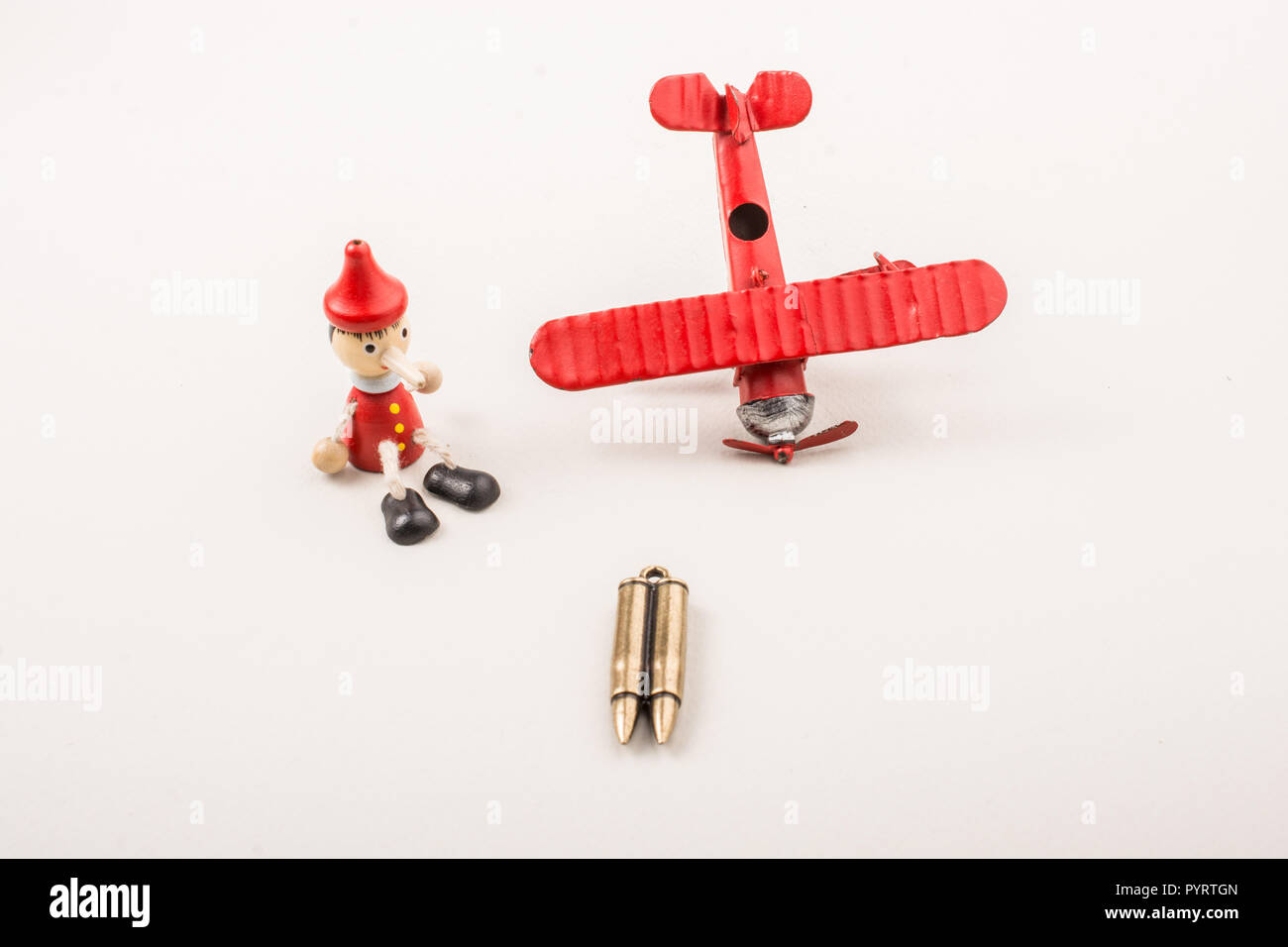 Airplane, Bullet and wooden pinocchio with his long nose Stock Photo ...