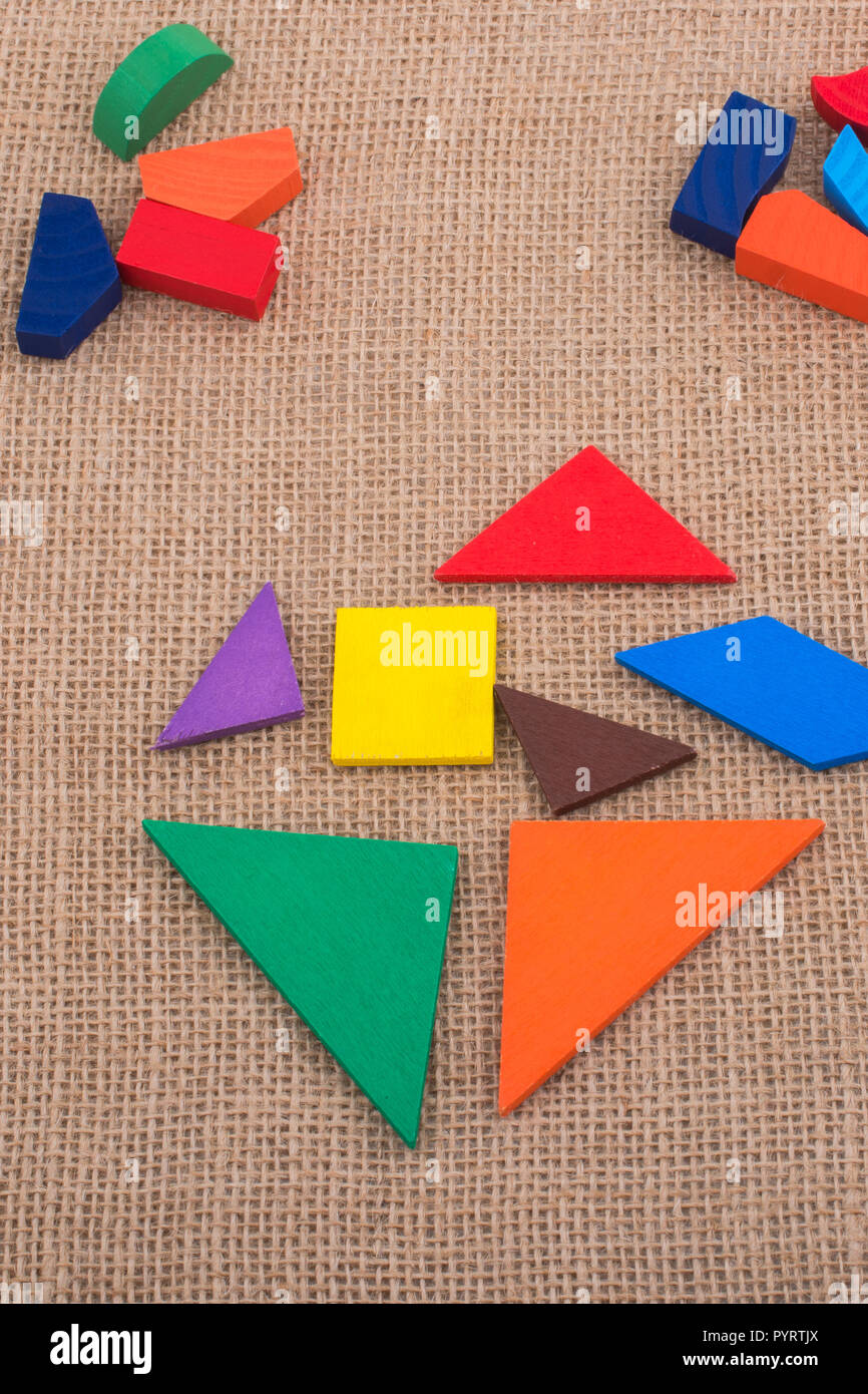 Colorful pieces of a square tangram puzzle Stock Photo - Alamy