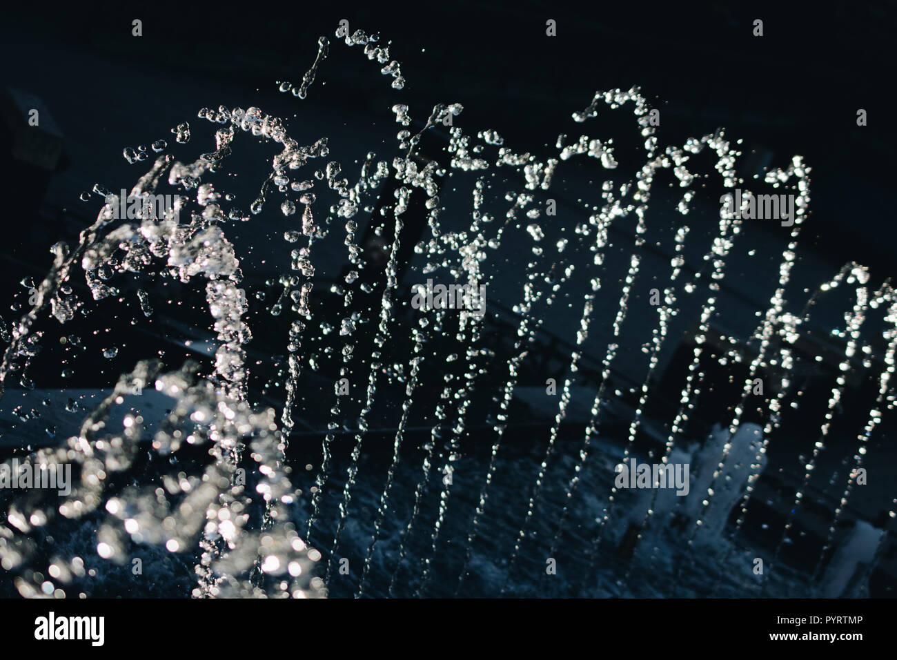 The fountains gushing sparkling water in a pool in a park Stock Photo ...