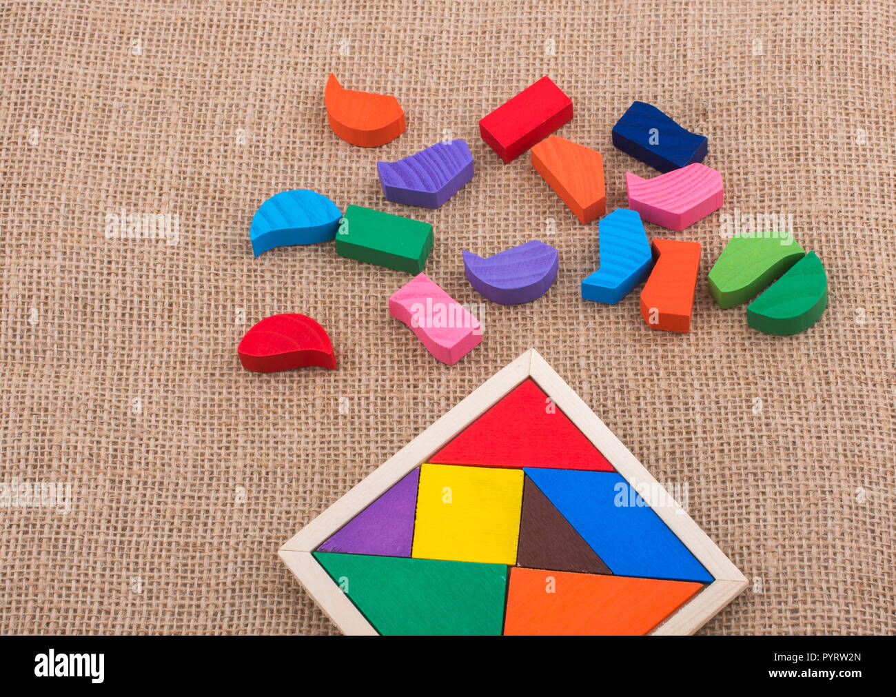 Colorful pieces of a square tangram puzzle Stock Photo - Alamy