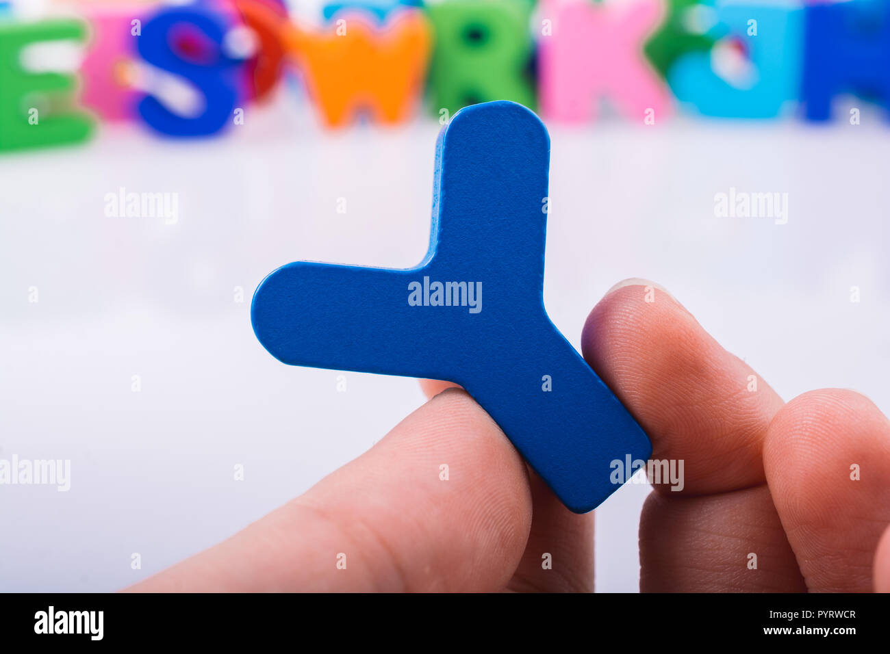 Hand holding letter cube Y of made of wood Stock Photo - Alamy