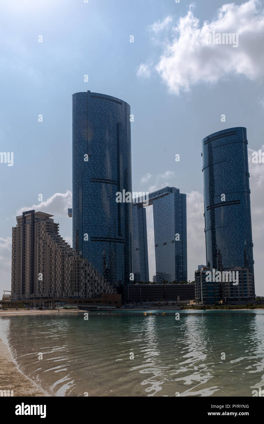 Skyscrappers of Al Reem Island, Shams Gate District against cloudy sky ...