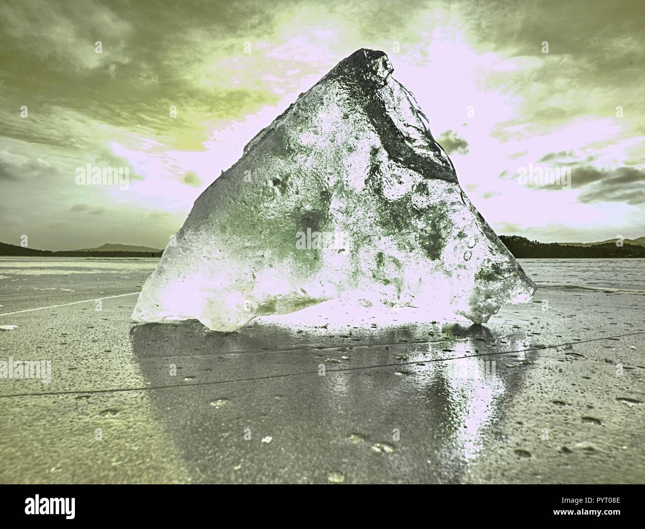 Ice breaking. Floe on frozen lake with sunset sky background Stock ...